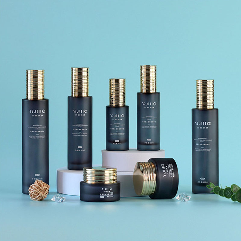 Flush shoulder flint glass bottle and cream jar - Karriv Packaging